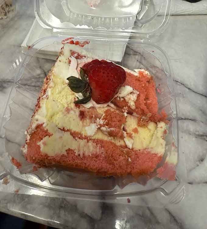 Strawberry cheesecake providing the sweet finale your taste buds deserve after conquering one of those legendary sandwiches.