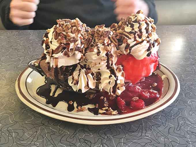 This banana split towers like a delicious monument to the philosophy that more is definitely more here.