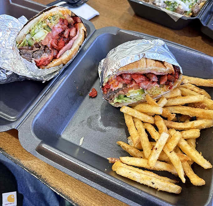 The Torta Cubana arrives like a delicious challenge, stuffed so full it requires both hands and zero regrets.