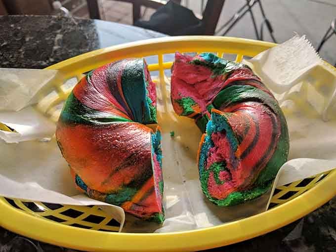 Yes, that's a rainbow bagel, proving that even traditional bagel shops know how to have a little fun with their craft.