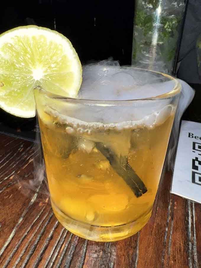 This pumpkin cocktail glows like it contains actual magic, which honestly might explain the taste.