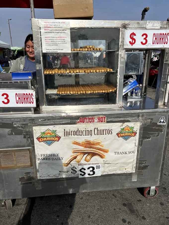 Fresh churros spinning in that warmer are basically edible happiness sticks, and resistance is completely and utterly futile.