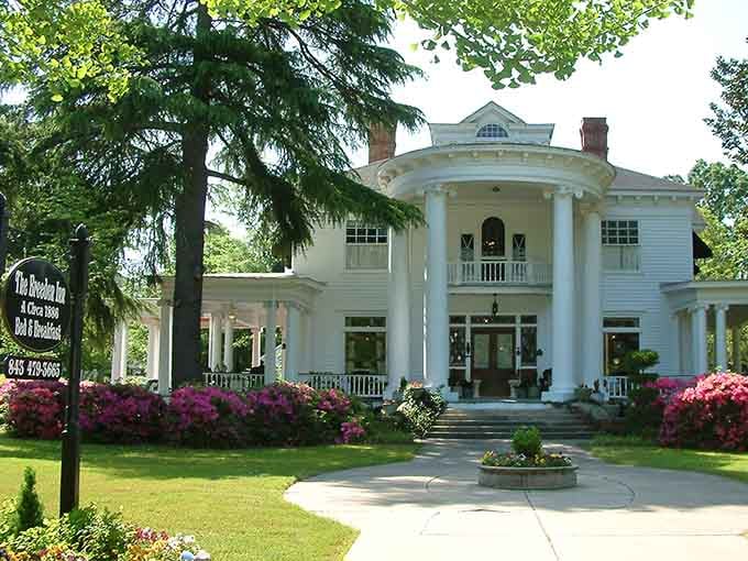The Breeden Inn's columns and azaleas are giving serious "Gone with the Wind" vibes, minus the drama.