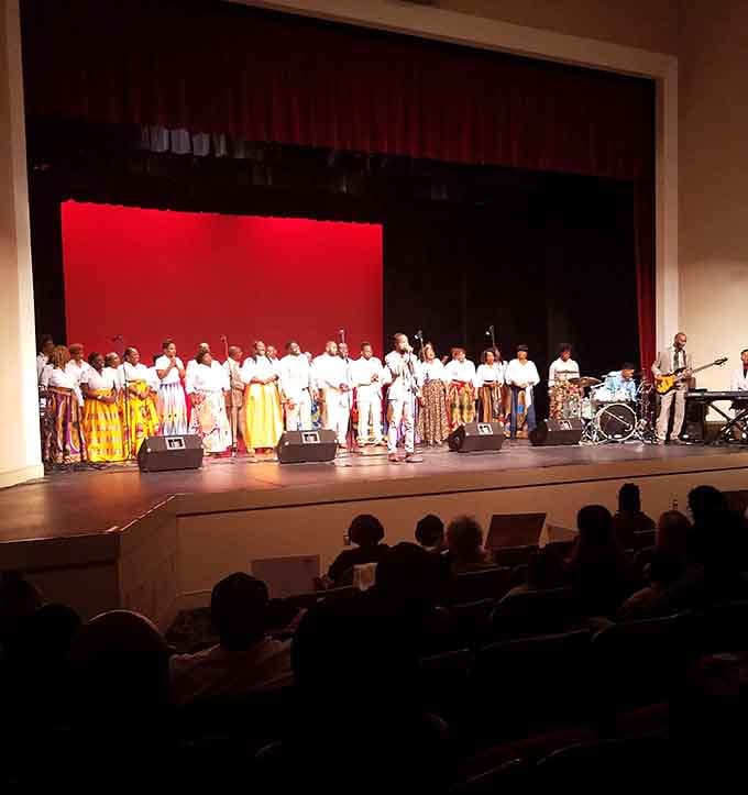 Live performers in vibrant costumes bring cultural richness to a stage where community gatherings create memories worth more than streaming services.