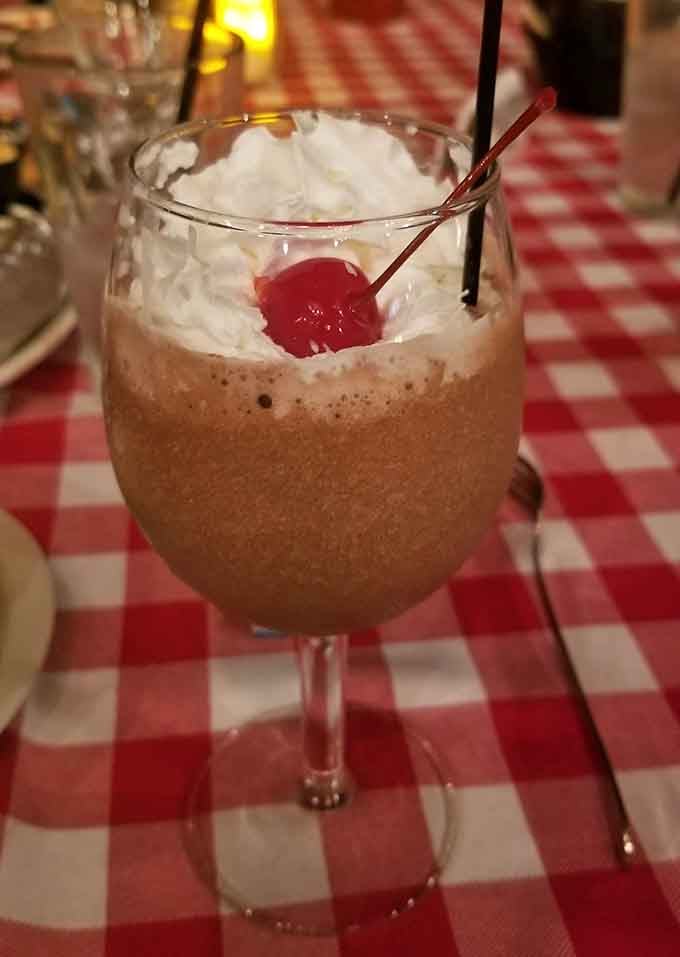 Bennie's famous Raccoon dessert arrives as a chocolate lover's dream, creamy and indulgent with whipped cream on top.