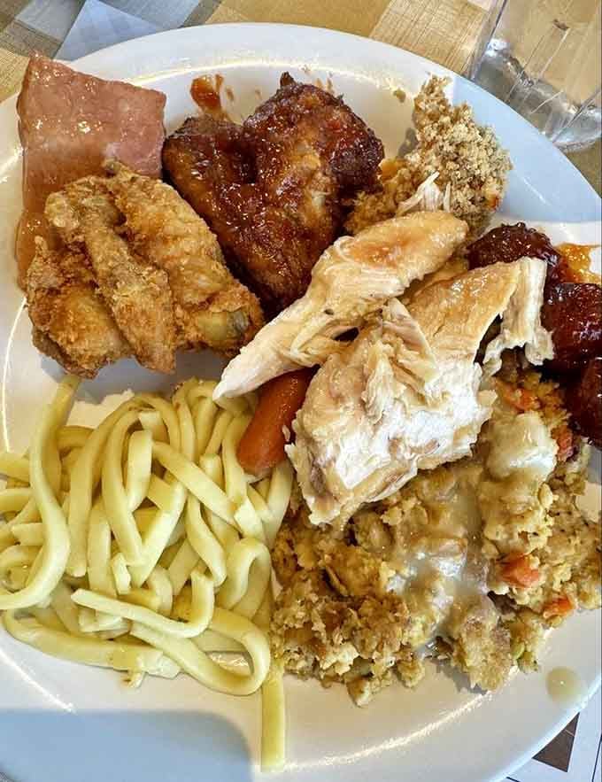 A buffet plate that proves you can, in fact, fit representatives from every food group in one sitting.