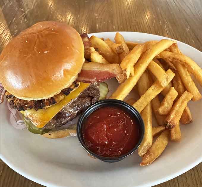 A juicy burger with golden fries and ketchup for dipping—sometimes simple perfection is all you need in life.