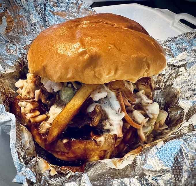 The Buccaneer sandwich towers like it's trying to reach the colorful lanterns, and honestly, it just might.