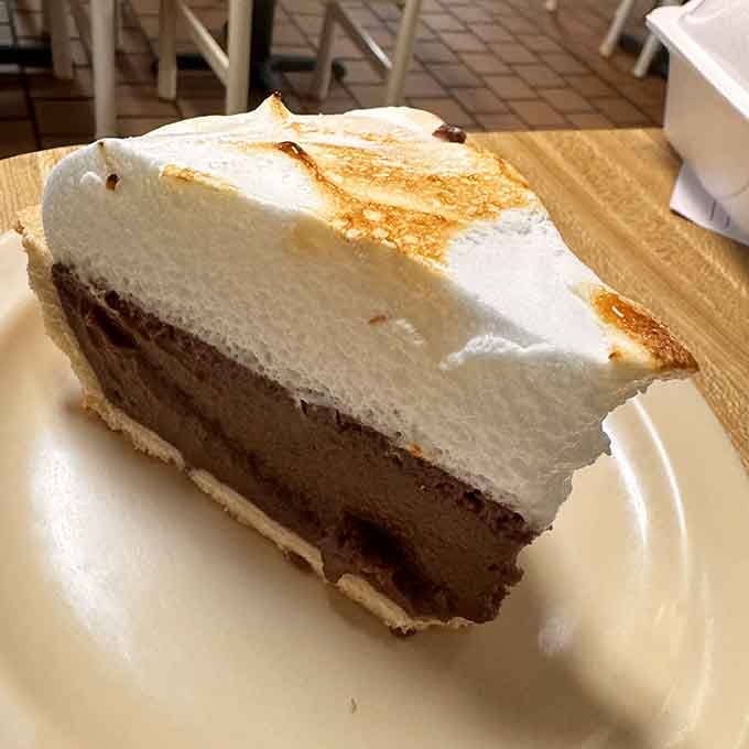 Chocolate pie with meringue piled high enough to require air traffic control clearance before serving.