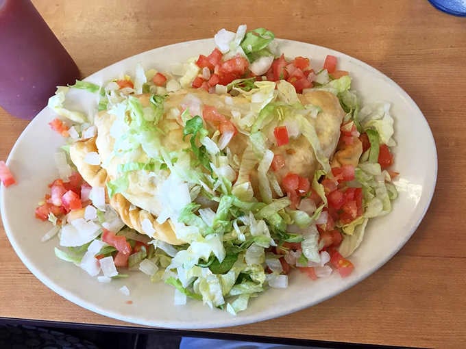 Sopapillas stuffed with enough cheese and toppings to make you question why you ever ordered anything else.