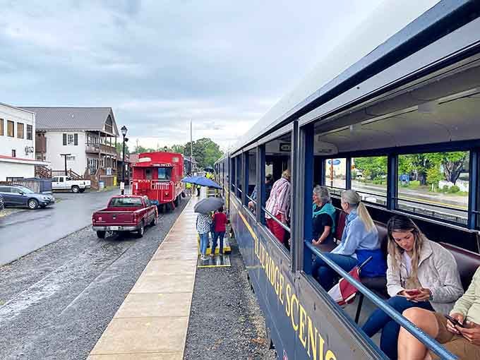 Passengers in the open-air car enjoying McCaysville's charm during the layover between mountain adventures and lunch plans.