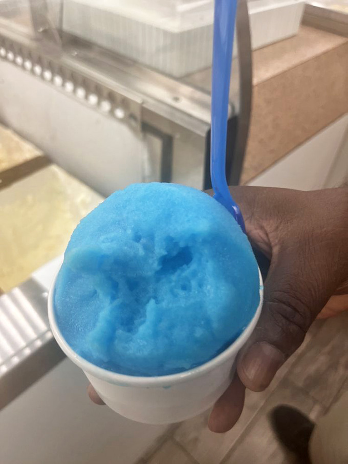 That electric blue Italian ice looks like it fell from a cartoon sky and landed perfectly in your cup.
