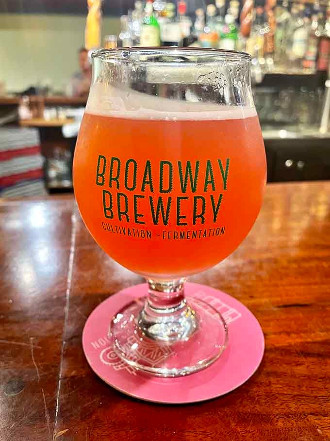 Their house-brewed beer glowing like liquid sunshine, ready to complement whatever deliciousness you've ordered.