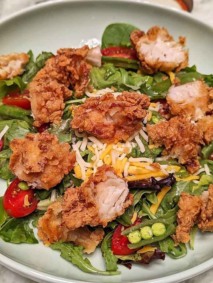Even salads get the fried chicken treatment here, because why should greens have all the boring fun?