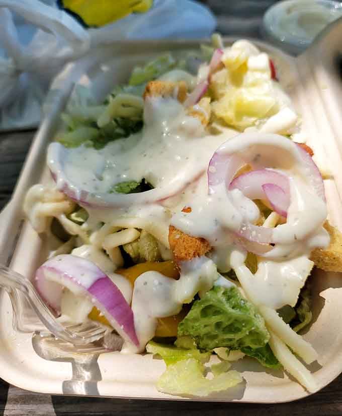 Even the garden salad gets the generous treatment with fresh veggies and creamy dressing.