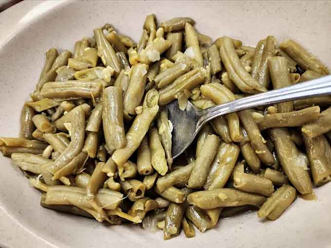 These aren't your crisp-tender green beans; they're slow-cooked Southern style, tender and full of flavor that vegetables rarely achieve.