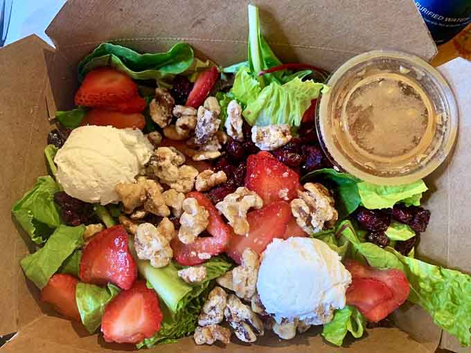 Fresh strawberries, candied walnuts, and goat cheese transform a simple salad into something you'd actually order without feeling virtuous about it.