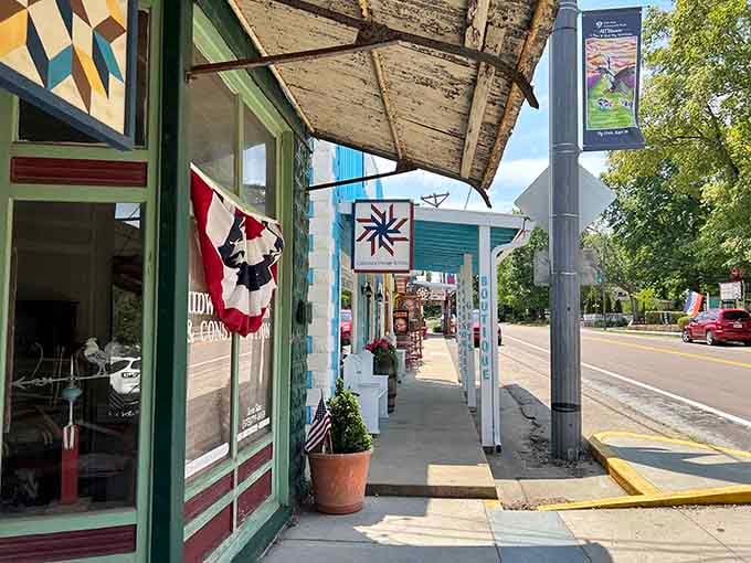 Patriotic bunting and quilted decorations frame storefronts painted in colors that make your camera smile with delight.