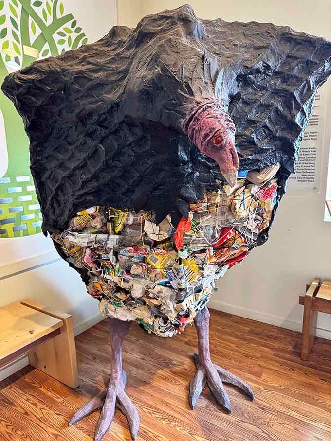 This striking bird sculpture transforms discarded materials into powerful commentary about waste and creativity.