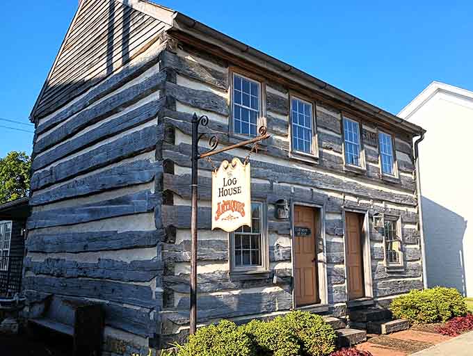 The Log House Antiques looks exactly like what pioneers would've built if they collected vintage signs.