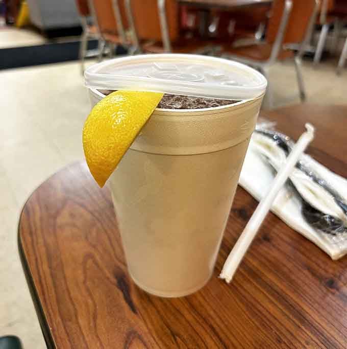 Fresh lemonade with a lemon wedge, because even your beverage should feel like a special occasion here.