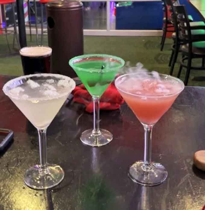 Colorful cocktails that would make even the Rainbow Road in Mario Kart jealous of their vibrant presentation.