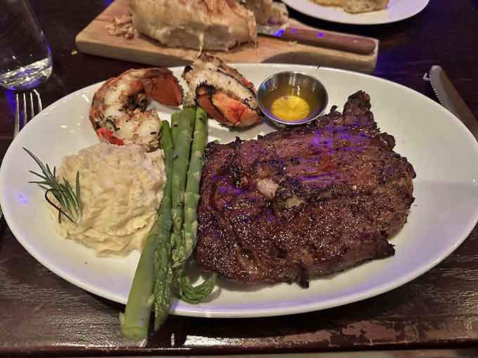 Ribeye paired with lobster tail proves that surf and turf never goes out of style, especially with creamy sides.