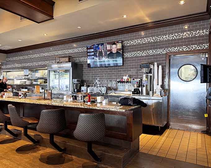 The counter at Central Diner & Grille offers front-row seats to where breakfast dreams become delicious reality.