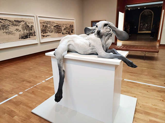 This reclining figure captures pure exhaustion with such accuracy, you'll want to offer it a pillow.