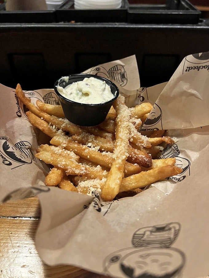 Garlic Parmesan fries dusted with enough cheese to make your cardiologist schedule a follow-up appointment immediately.