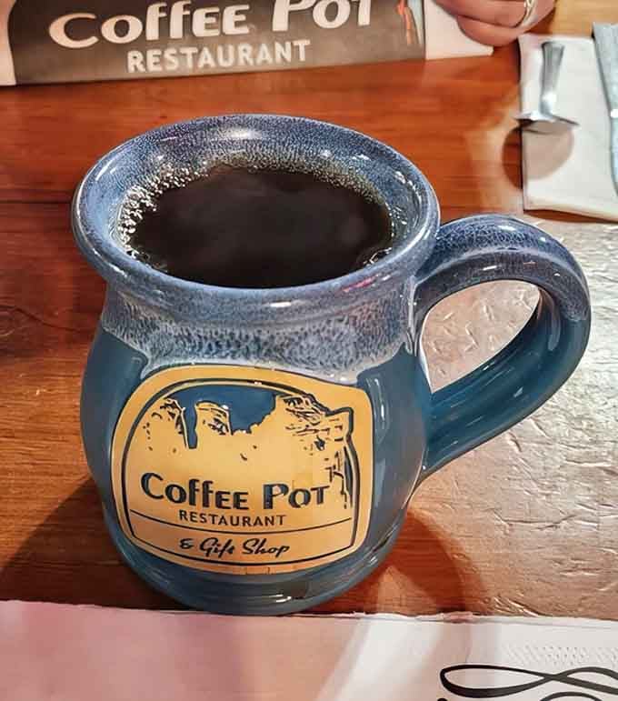 Fresh-brewed coffee served in their signature mug&mdash;because some mornings require both caffeine and a souvenir.