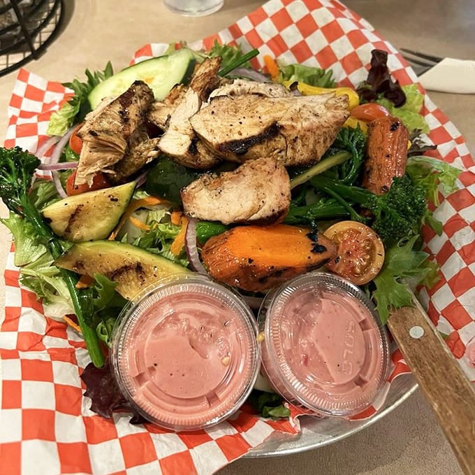 A chicken salad that actually looks like a salad, topped with perfectly grilled meat and enough fresh vegetables to appease guilt.