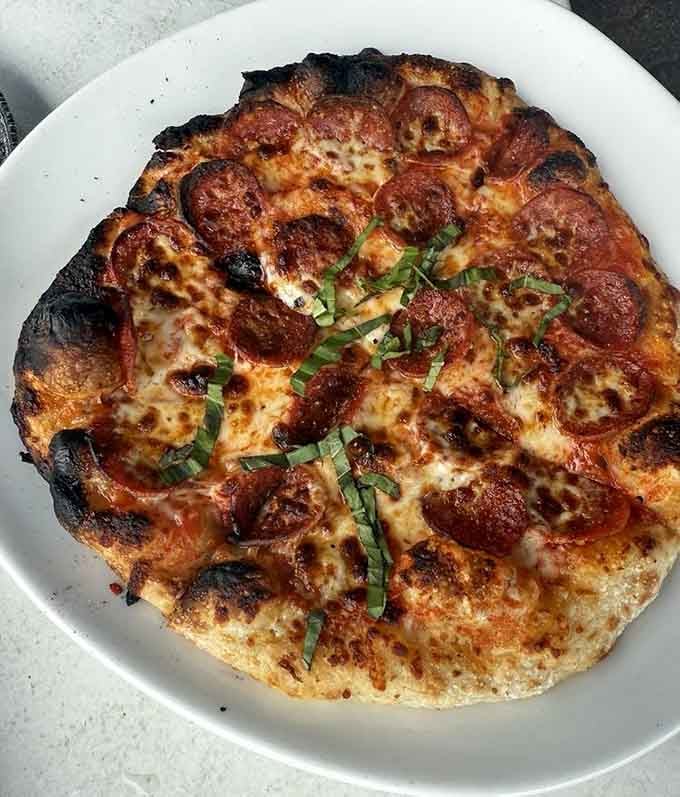 Wood-fired pepperoni pizza with that perfect char on the crust, proving Cleveland knows its way around a proper pie.
