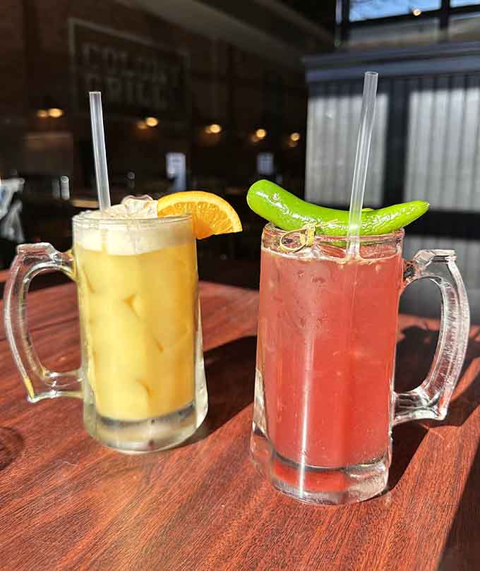 Colorful cocktails with citrus garnishes pair perfectly with pizza, because hydration is important during carb consumption.