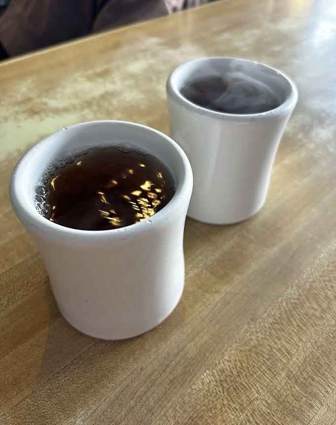 Two cups of tea signal the start of something special, like the opening credits to your favorite show.