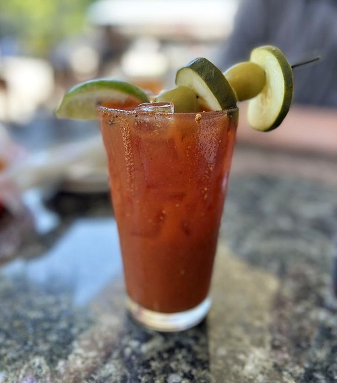 A Bloody Mary garnished so generously it's practically a salad, the perfect companion to your barbecue feast ahead.