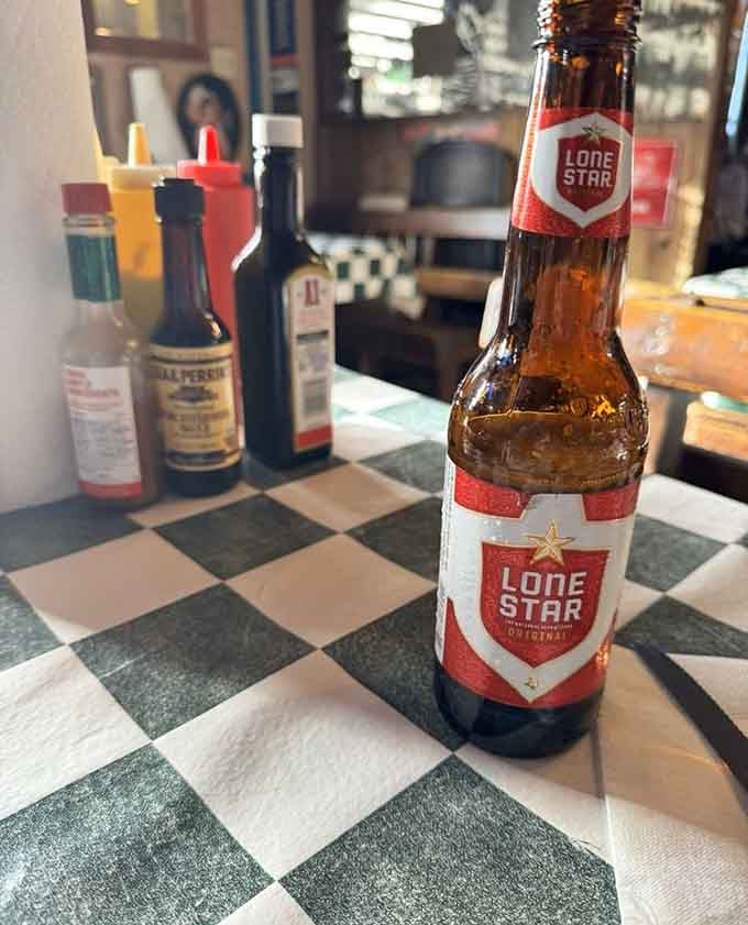 Nothing says Texas quite like a cold Lone Star waiting on a checkered tablecloth beside your burger arsenal.