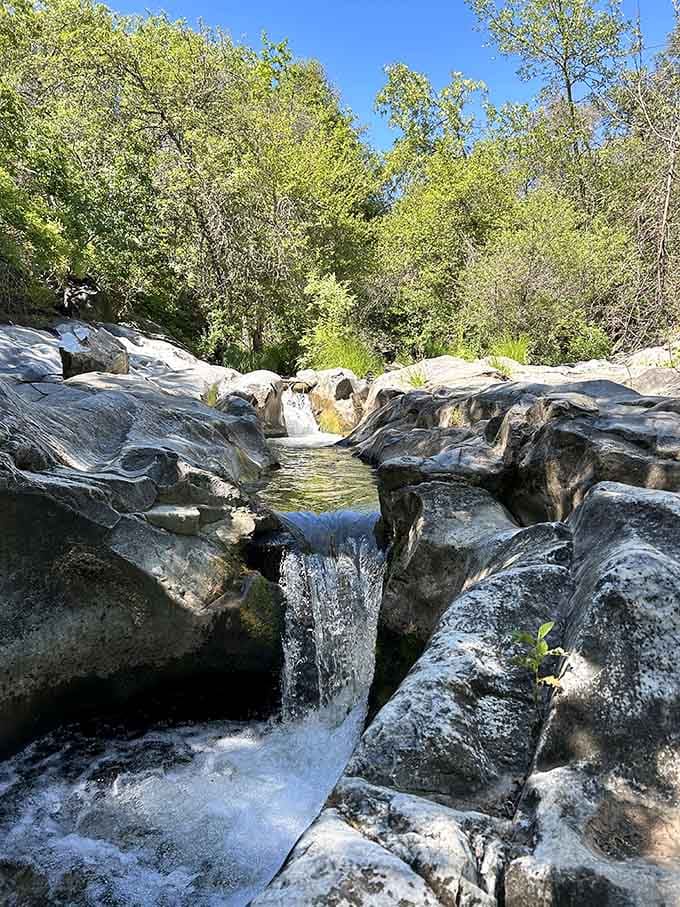These natural waterfalls outside the cave provide the perfect soundtrack for your wilderness adventure playlist.