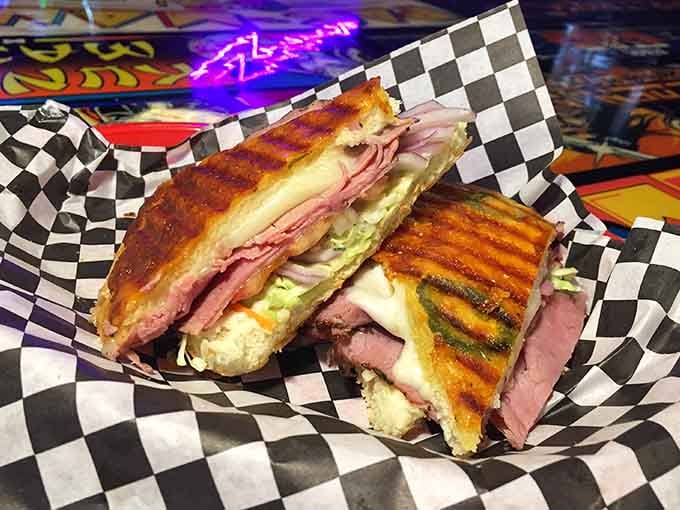 Grilled panini perfection with melted cheese and quality meats, served on checkered paper like the diners remembered fondly.