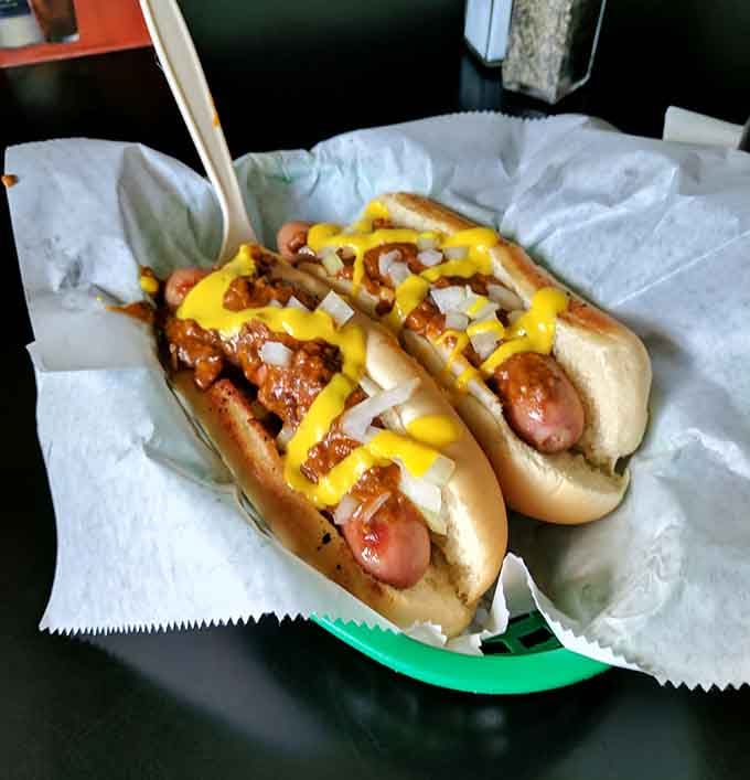 Two chili dogs loaded with mustard and onions: Michigan comfort food at its absolute finest.
