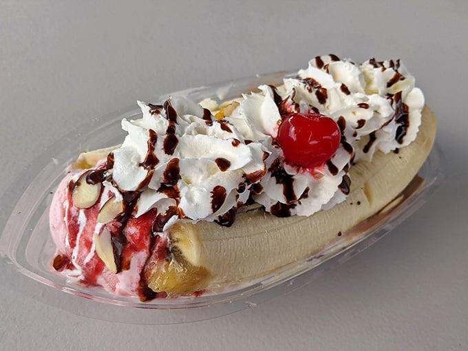 The banana split that launched a thousand napkins, complete with whipped cream mountains and a cherry on top.