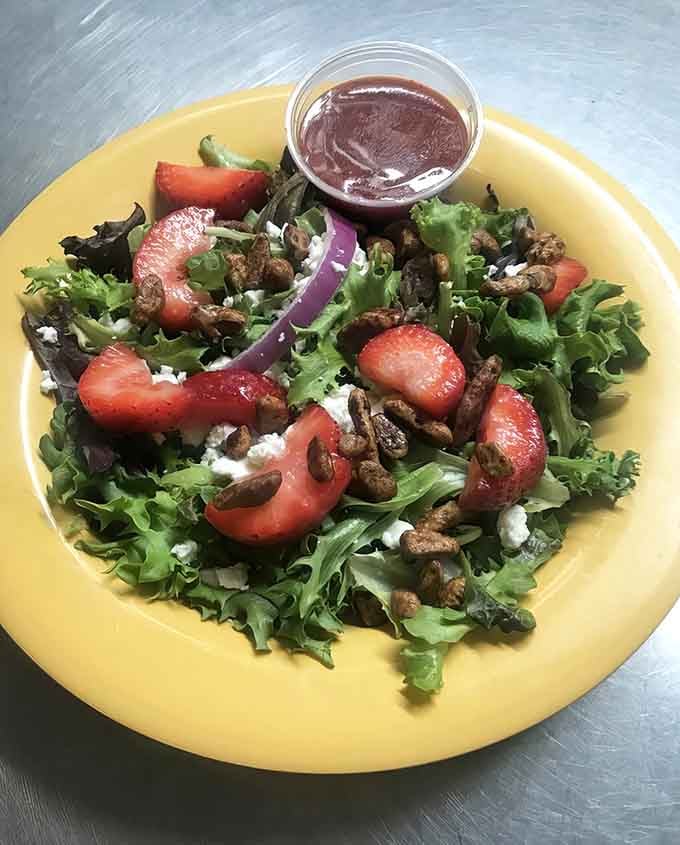 Fresh strawberries and candied pecans on greens make salad feel less like obligation, more like celebration.