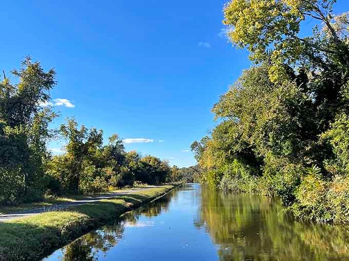 Mirror-smooth water reflecting perfect blue skies makes you wonder if you accidentally drove into a screensaver from 1998.