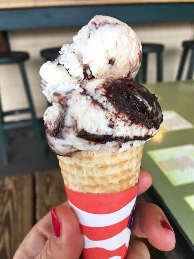 Ice cream swirled high enough to require engineering skills and a napkin strategy before your first lick.