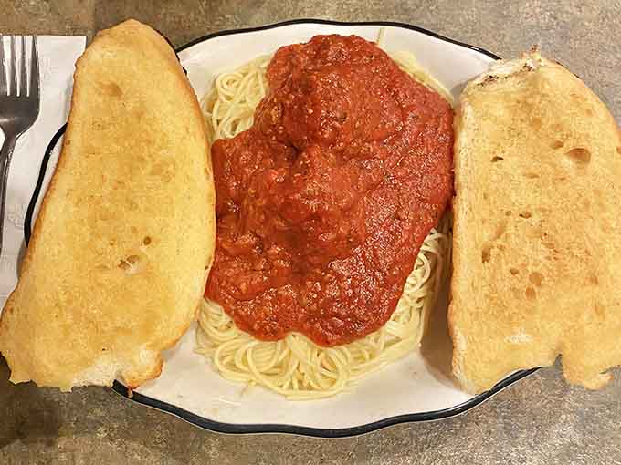 Two giant garlic toasts flanking a mountain of spaghetti is the carb-lover's dream come true.
