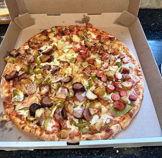 A fully loaded pizza that doesn't know the meaning of restraint, and frankly, neither should you when ordering here.