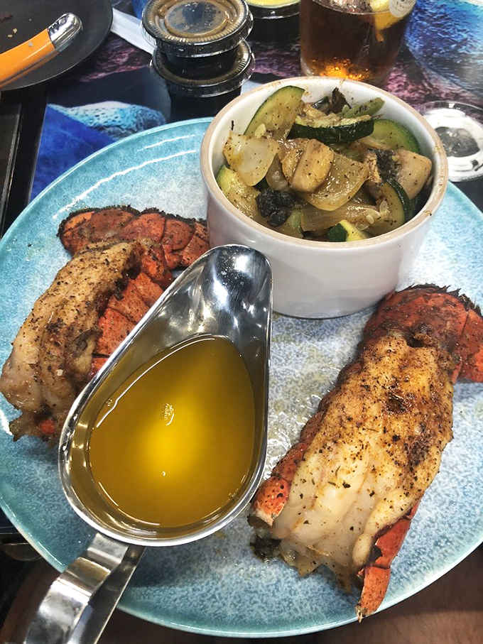 Perfectly seasoned lobster tails with drawn butter, because fancy dining existed long before humans showed up to enjoy it.