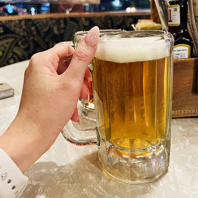 A frosty mug of beer in a Western tavern hits different—it's like every sip comes with a side of frontier history and good old-fashioned hospitality.