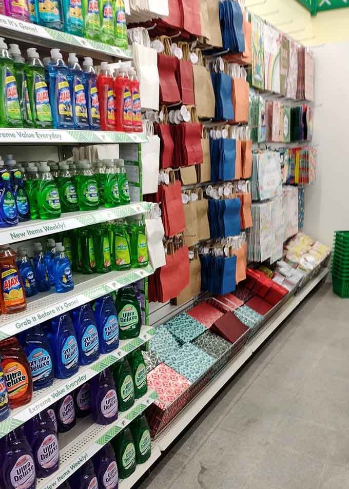 Name-brand dish soap shares shelf space with gift bags, because adulting and celebrating coexist here peacefully.