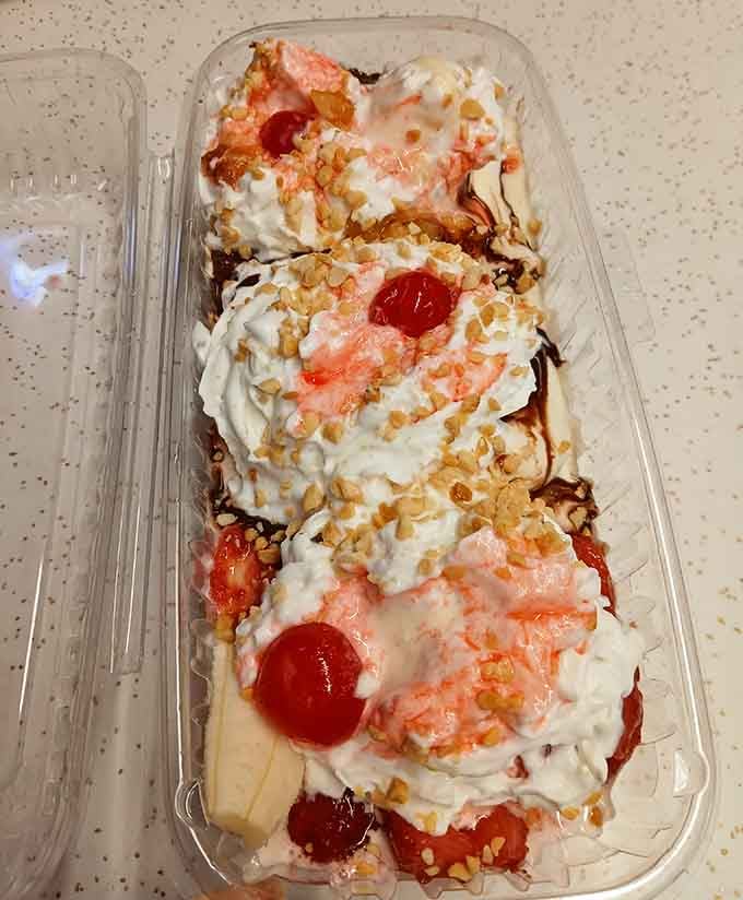 Three scoops of happiness topped with whipped cream, cherries, and the kind of joy that requires multiple napkins.